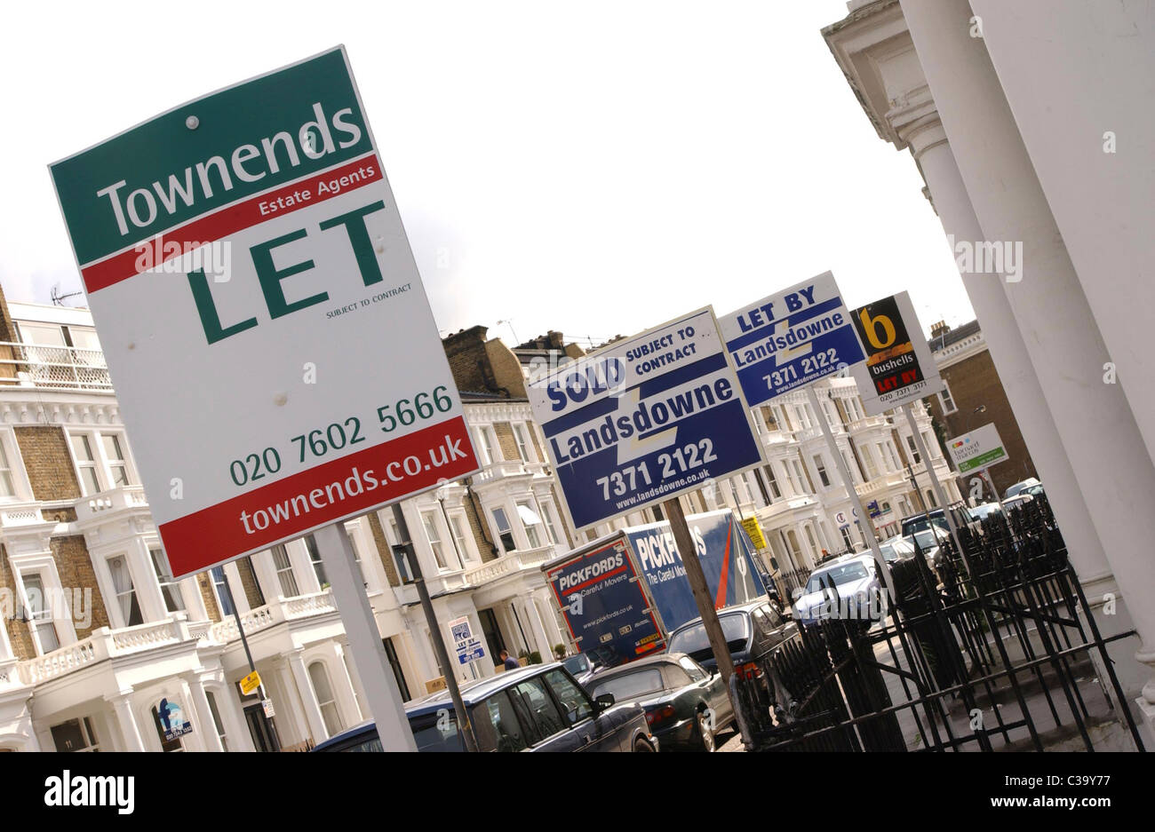 various For Sale and To Let signs outside houses Stock Photo - Alamy