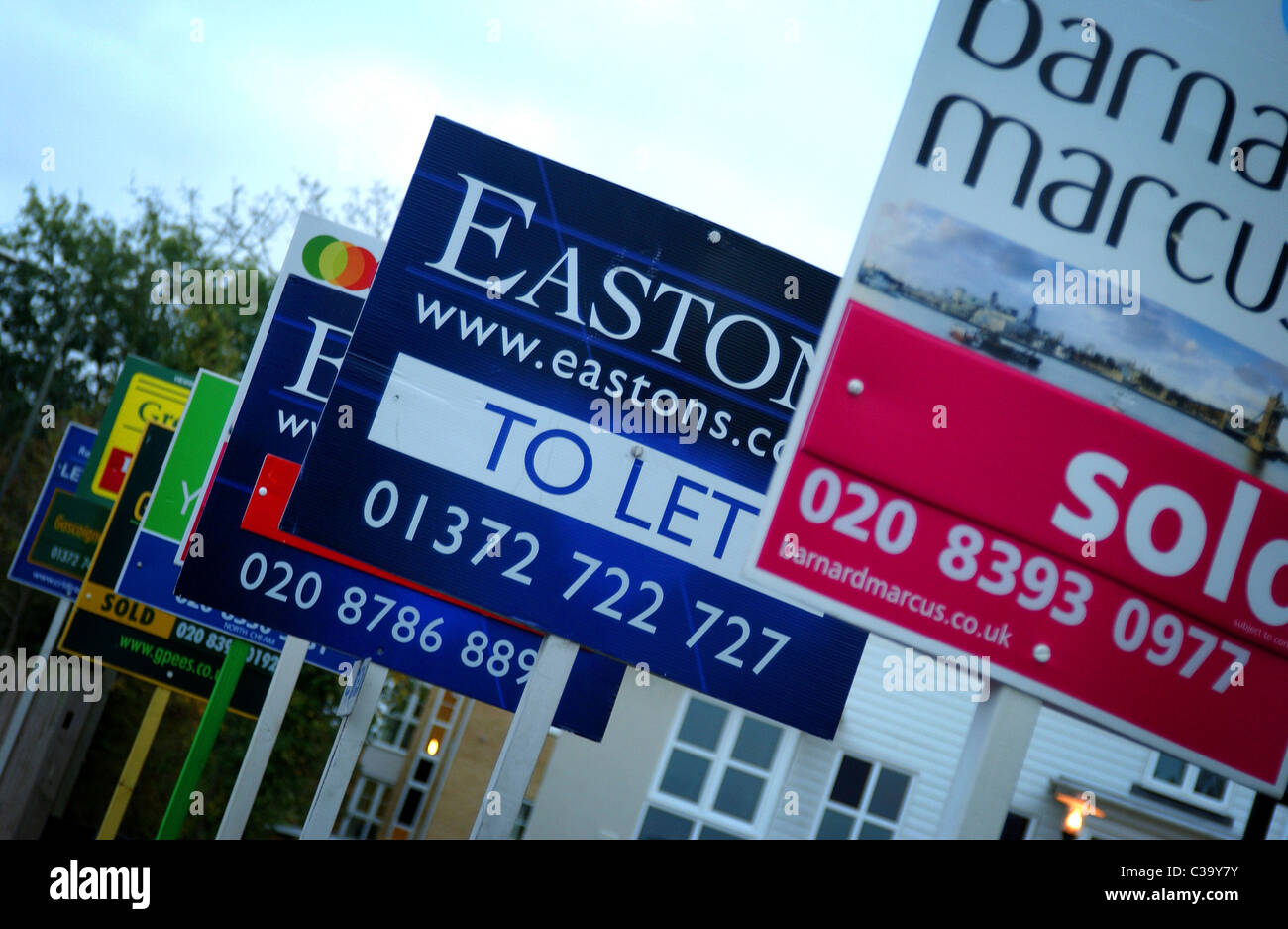 various For Sale and To Let signs outside houses Stock Photo - Alamy