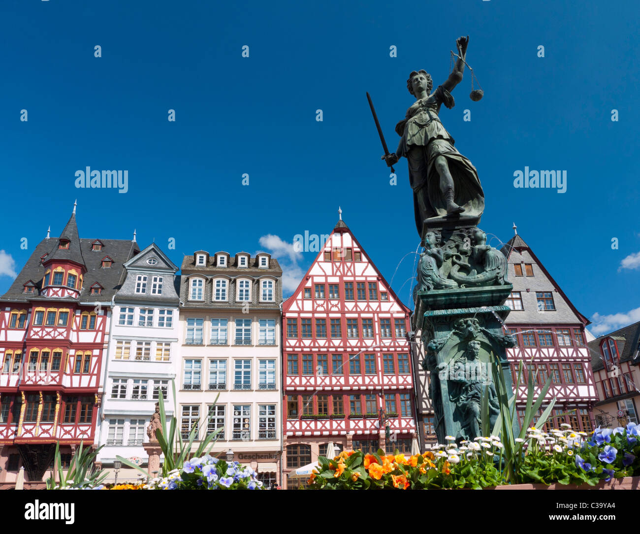 Romer Square with historic timbered houses and Justitia fountain statue ...
