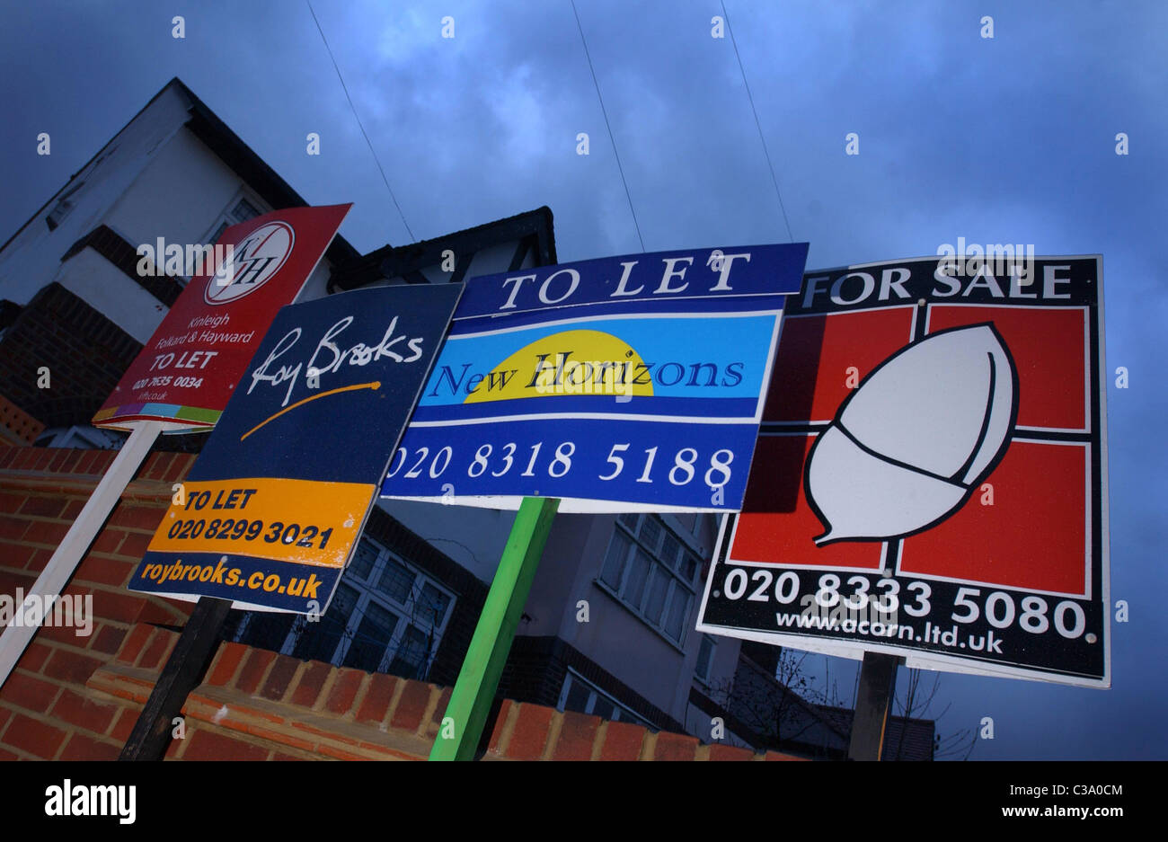 various For Sale and To Let signs outside houses Stock Photo - Alamy