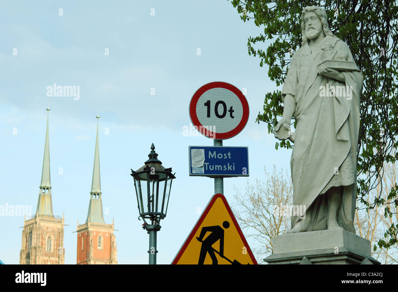 Saint John Evangelist statue and cathedral towers Wroclaw Ostrow Tumski ...