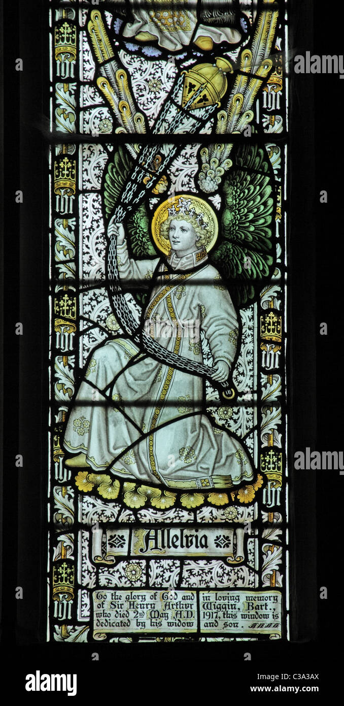 A stained glass window by C E Kempe & Co. depicting an angel swinging a ...