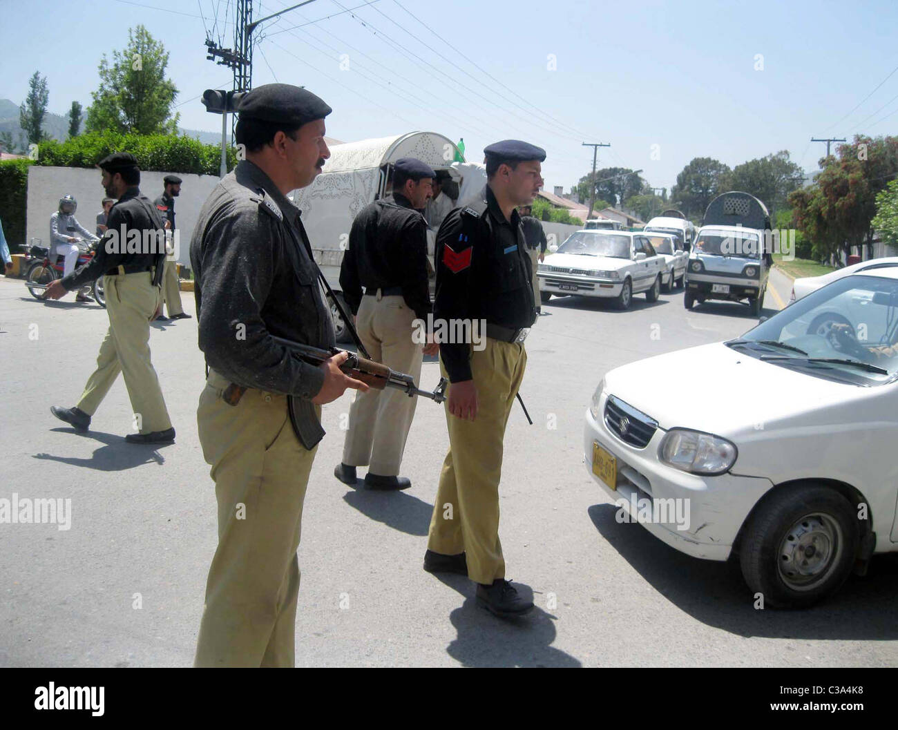 Policemen stop vehicles to move forward as they were blocked the area ...
