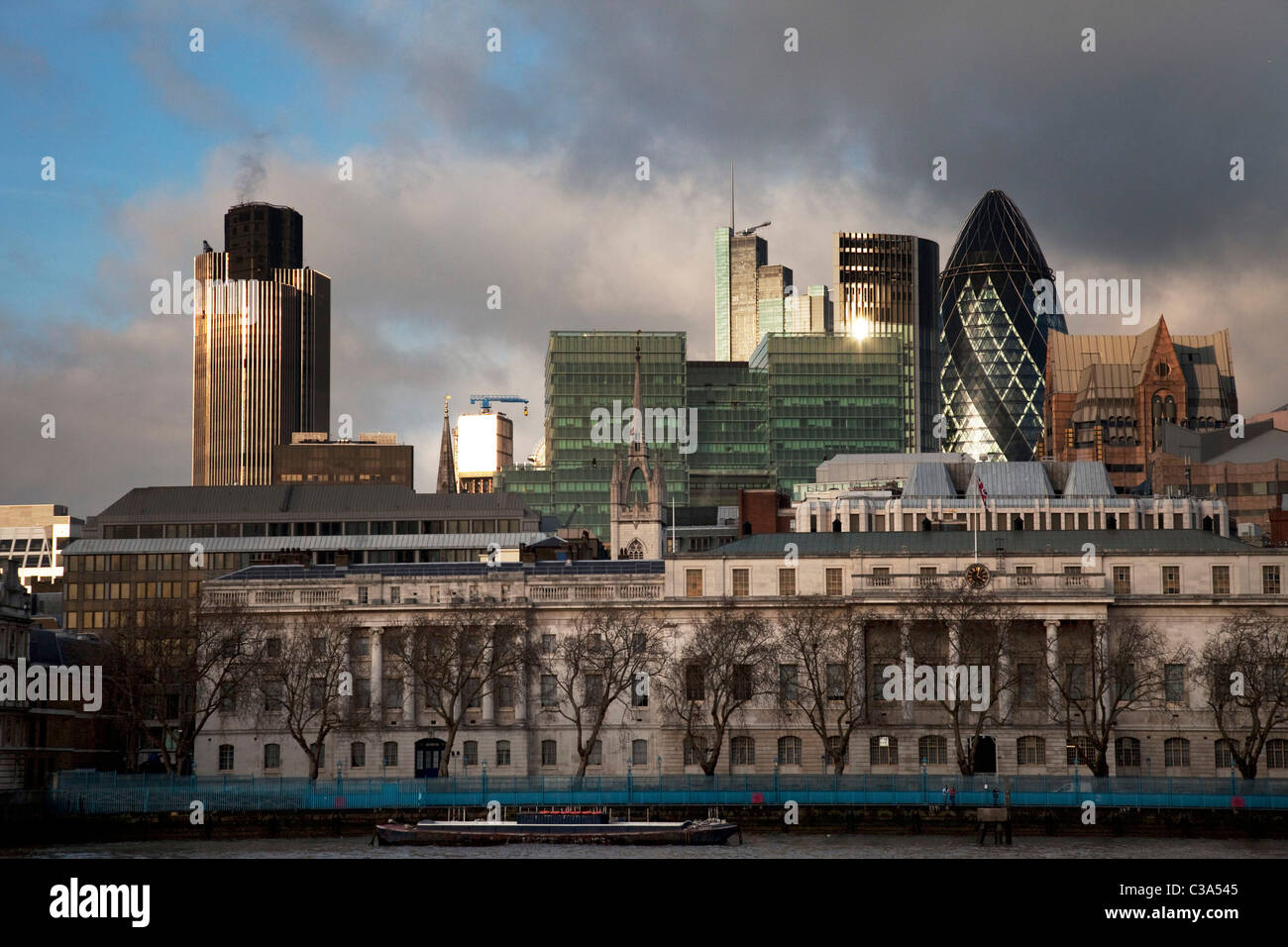 City of London behind buildings along the river. This stretch of the ...