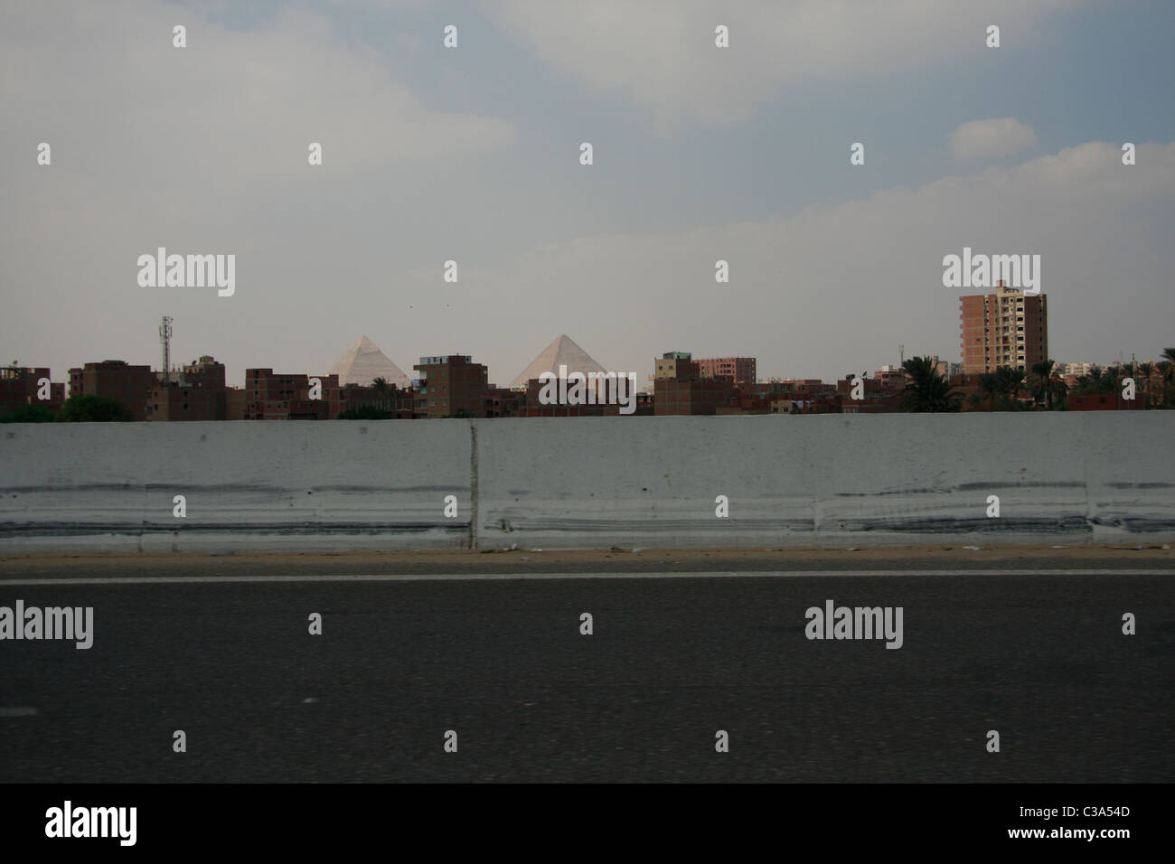The Giza pyramids from a highway in Cairo, Egypt Stock Photo - Alamy