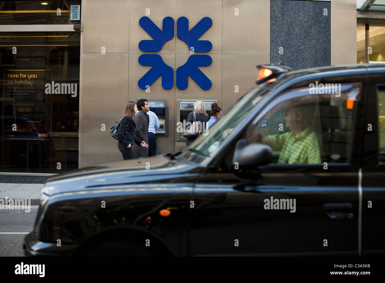 Customers using RBS cashpoints Stock Photo - Alamy