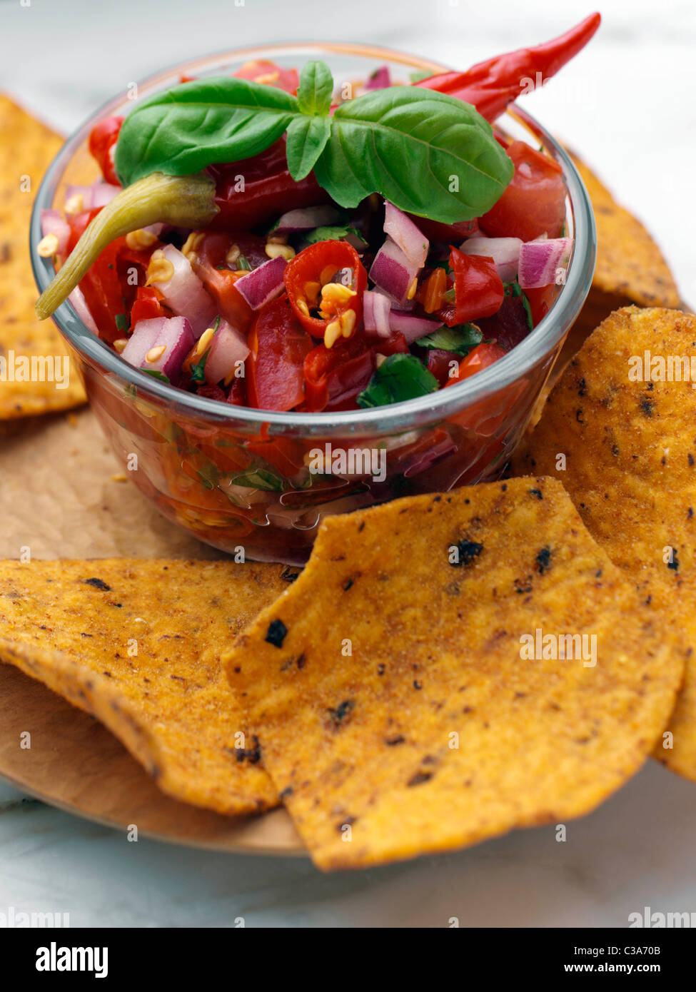 Red chilli salsa with tortilla chips Stock Photo - Alamy