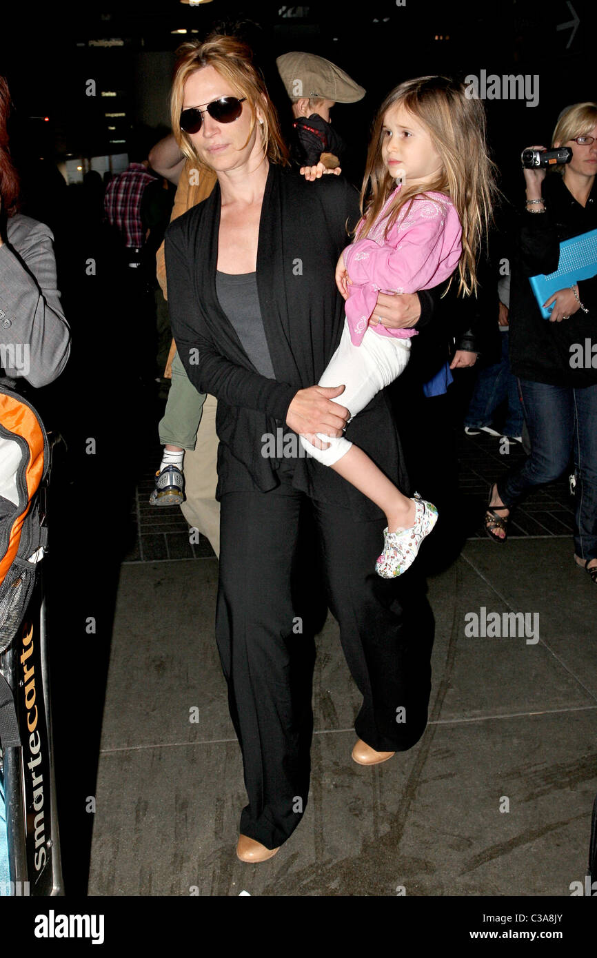 Tracy Warbin and Auden Wyle Noah Wyle and family arriving at LAX Los ...