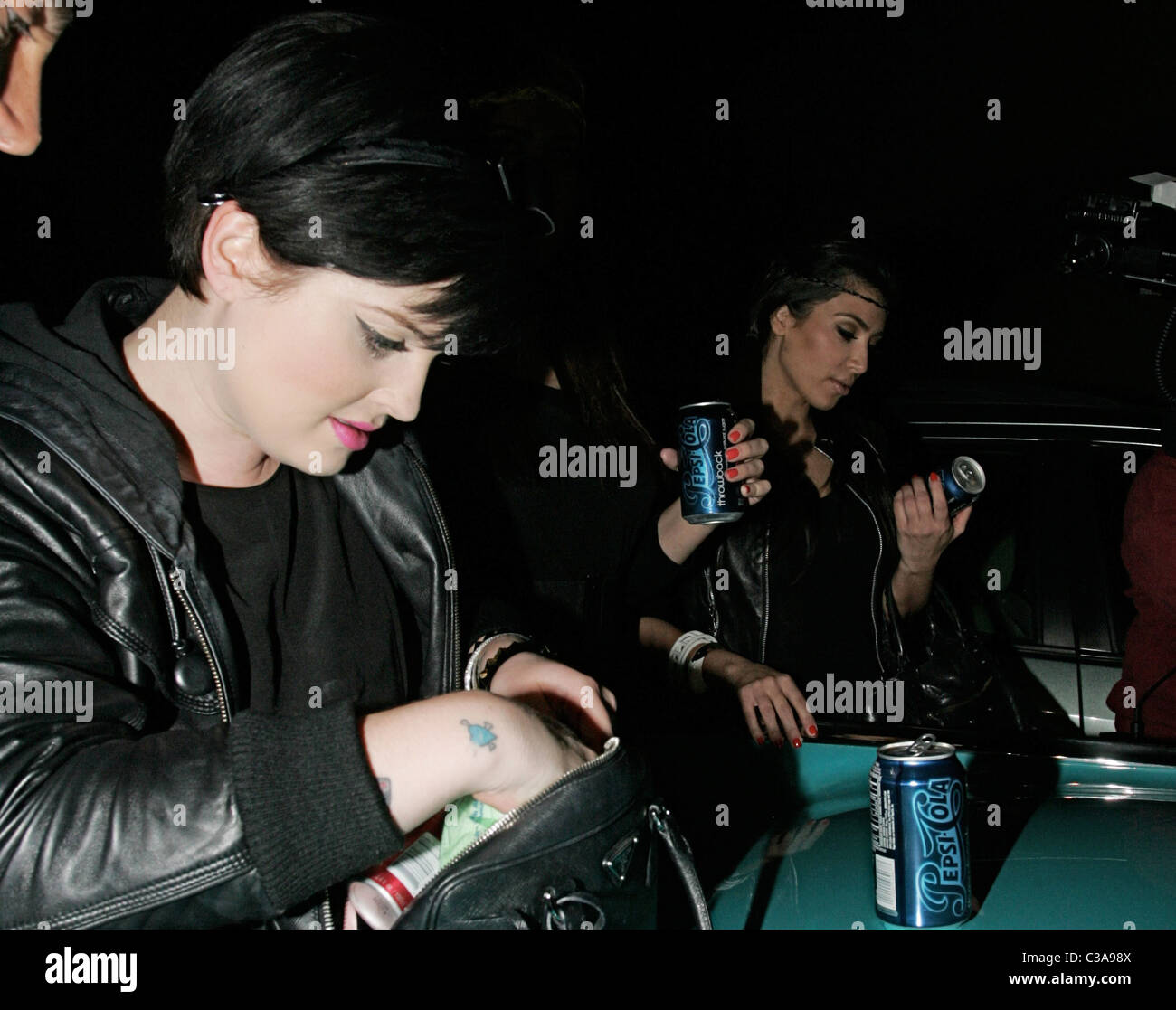 Kelly Osbourne and Kim Kardashian depart a party launching Pepsi ...