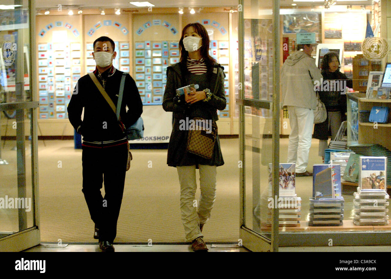 Atmosphere Tourists wear surgical masks to prevent catching Swine flu ...