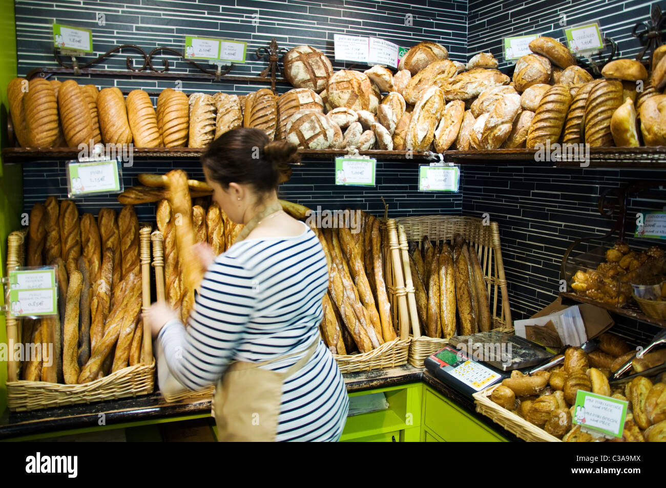 Woman working in boulangerie bakers shop bakery in Paris Stock Photo ...