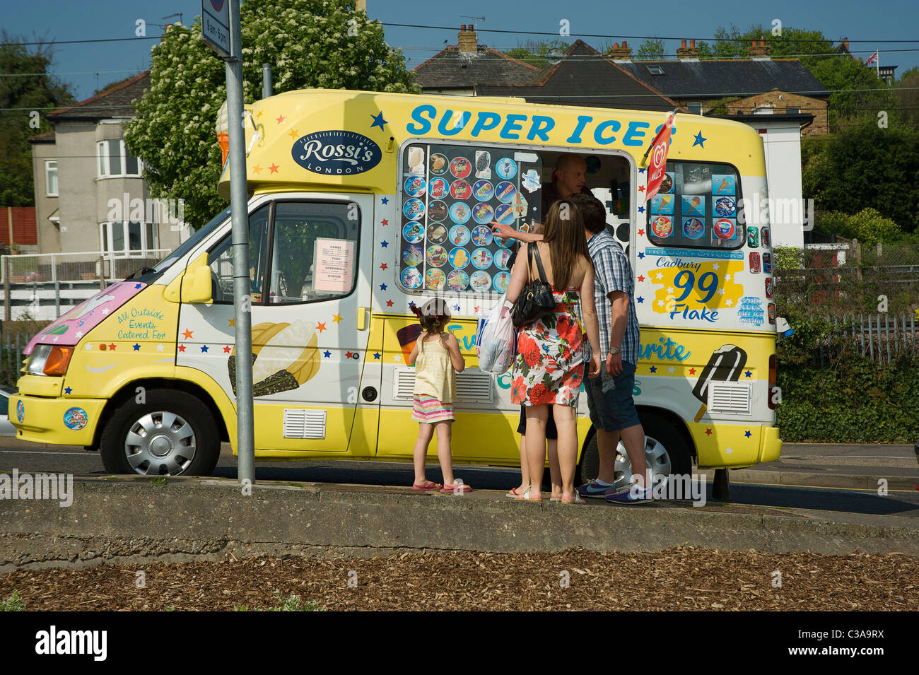 Ice cream van at roadside with customers Stock Photo - Alamy