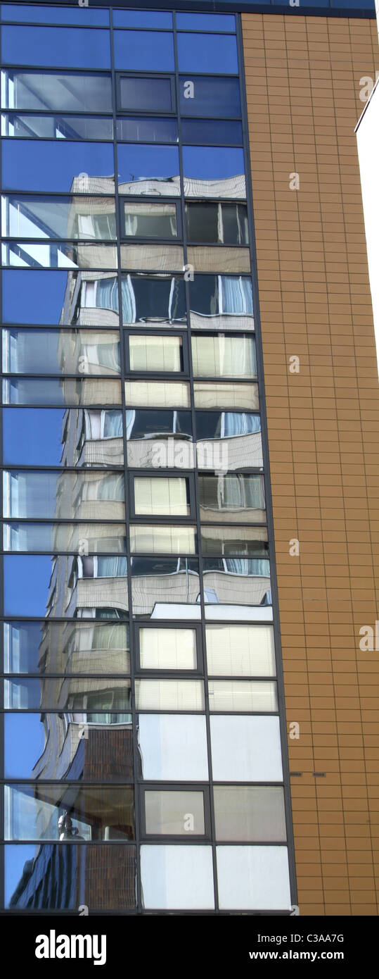 The Hilton Hotel in Leeds reflected in an office block windows Stock ...