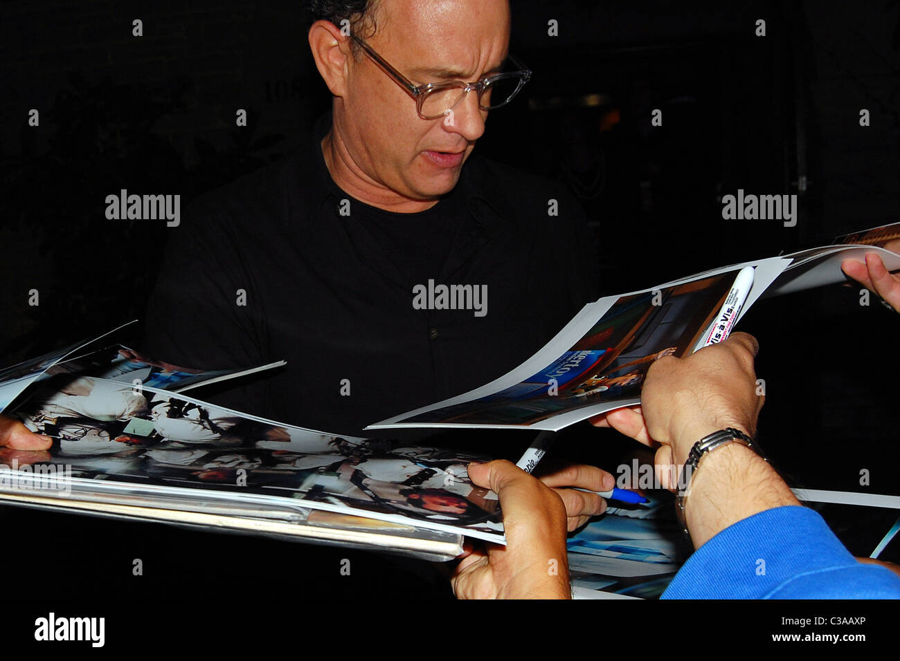 Tom Hanks signs autographs for waiting fans outside the Geffen ...