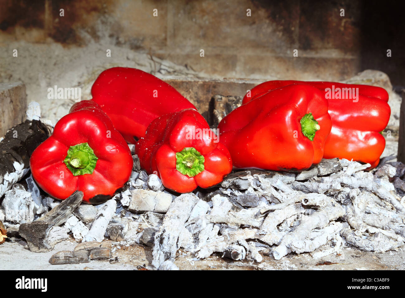 grilled red peppers ember fire vegetables food Stock Photo - Alamy