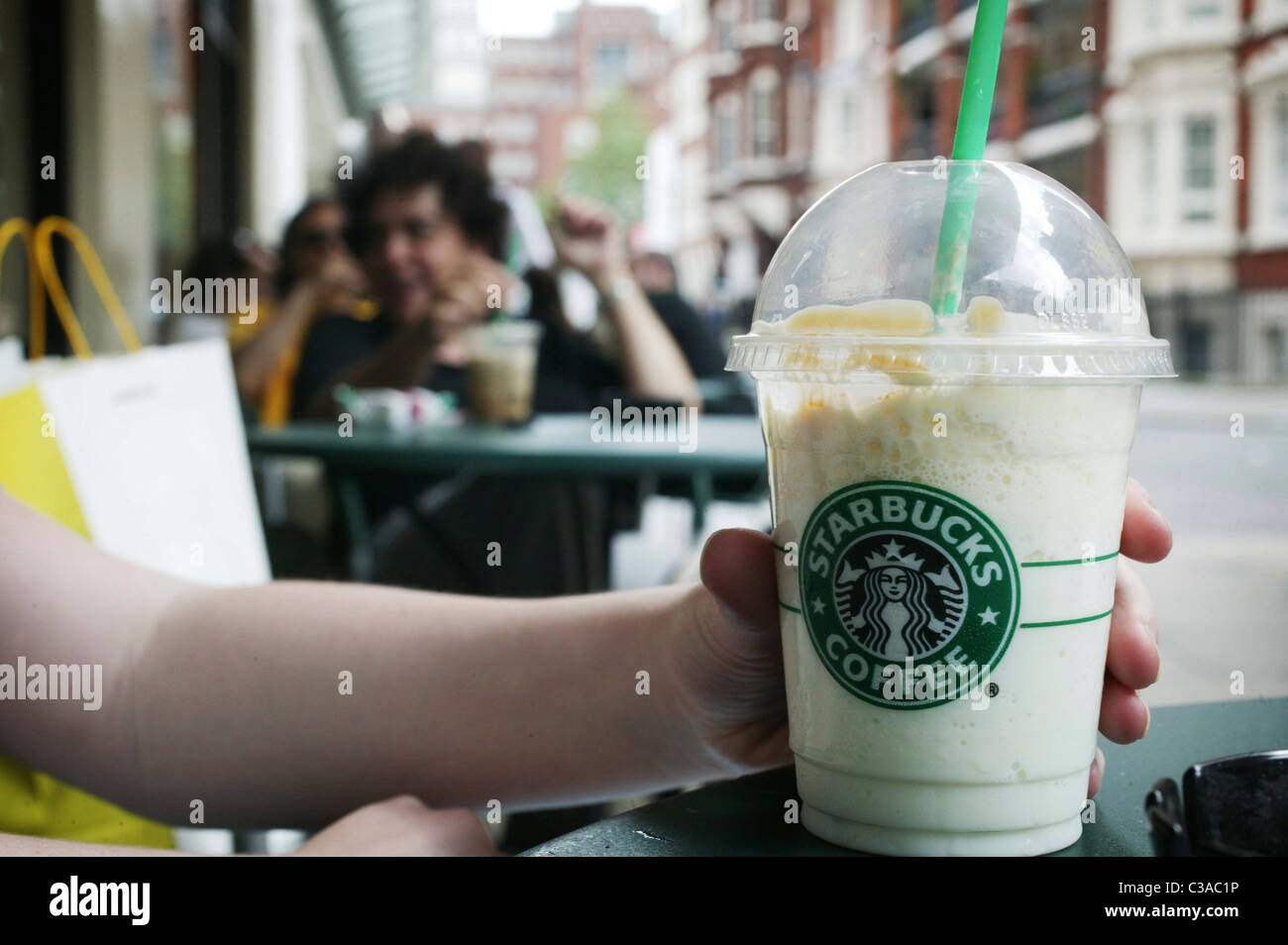 Woman drinking starbucks hi-res stock photography and images - Alamy