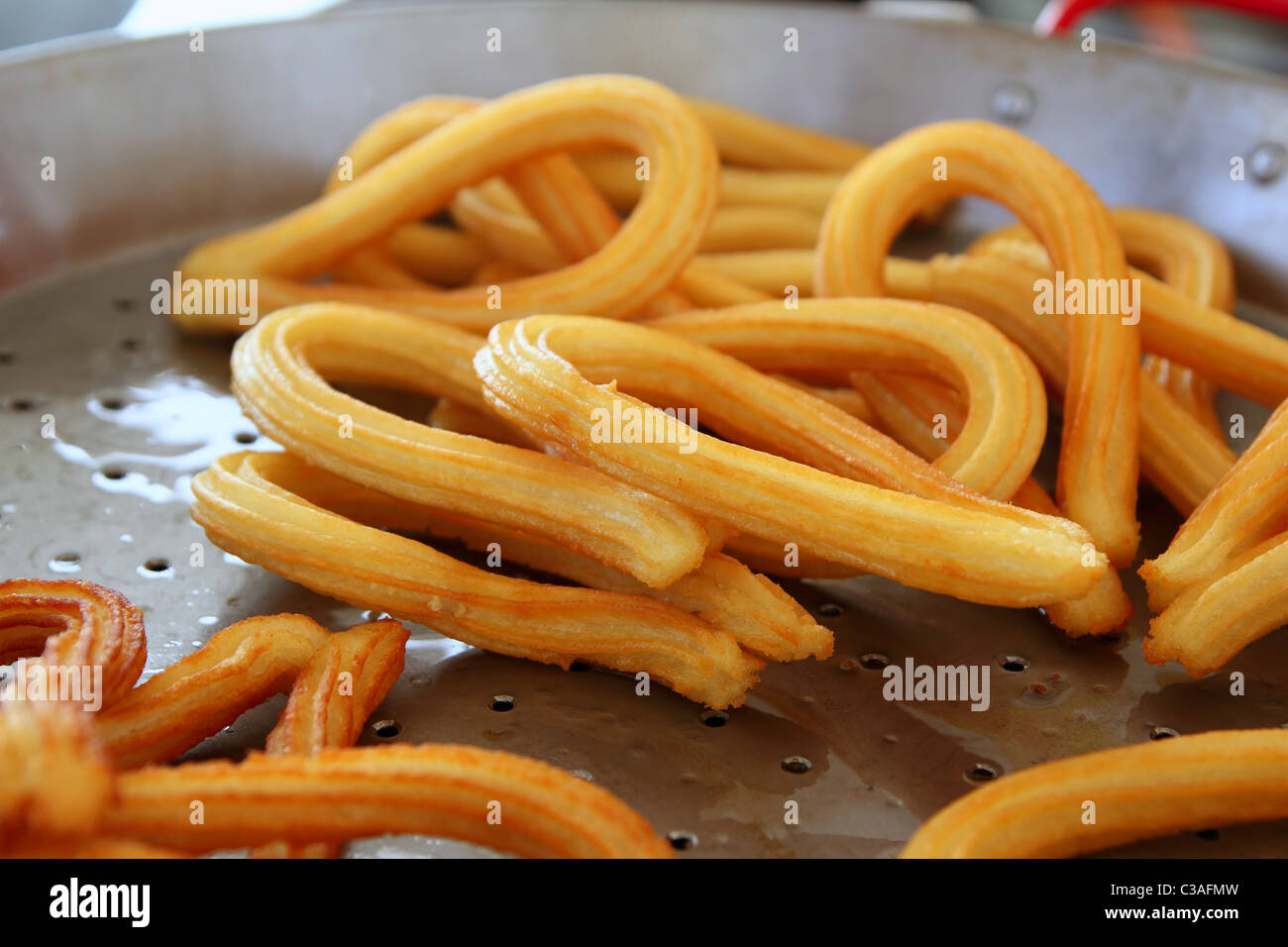 churros fried with vegetal oil unhealthy fat food Stock Photo - Alamy