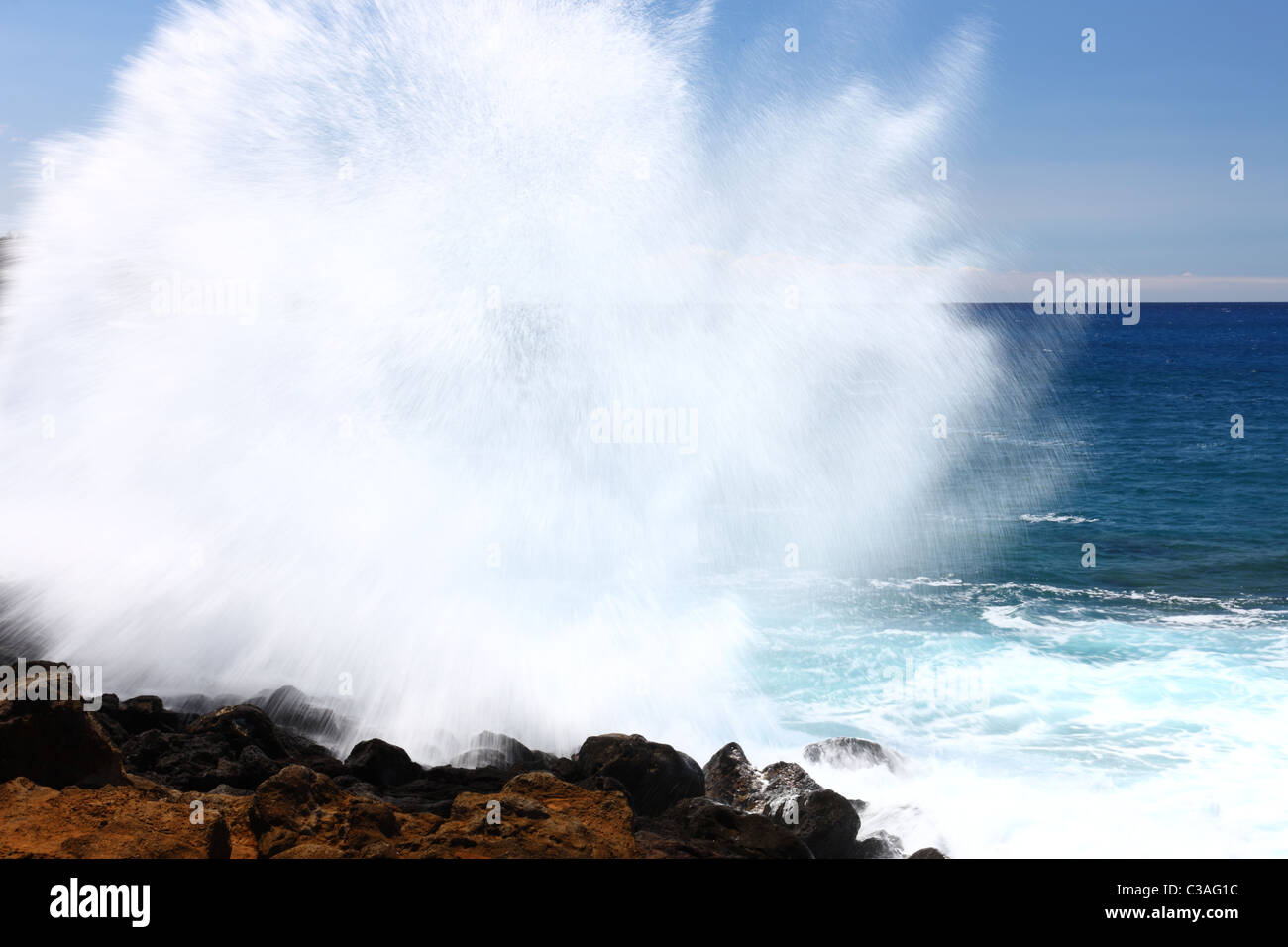Waves splashing at Hawaiian coast Stock Photo - Alamy