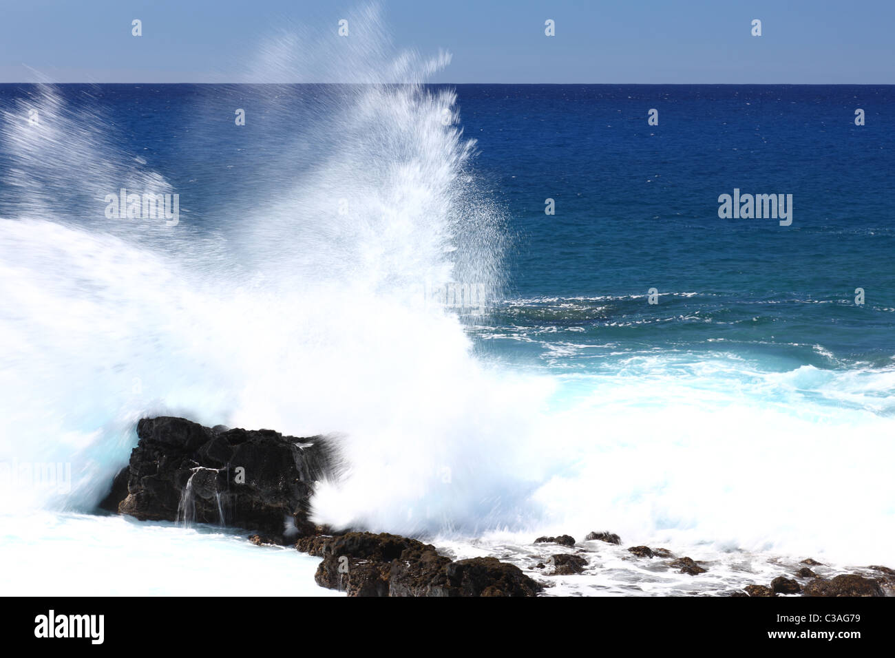 Waves splashing at Hawaiian coast Stock Photo - Alamy