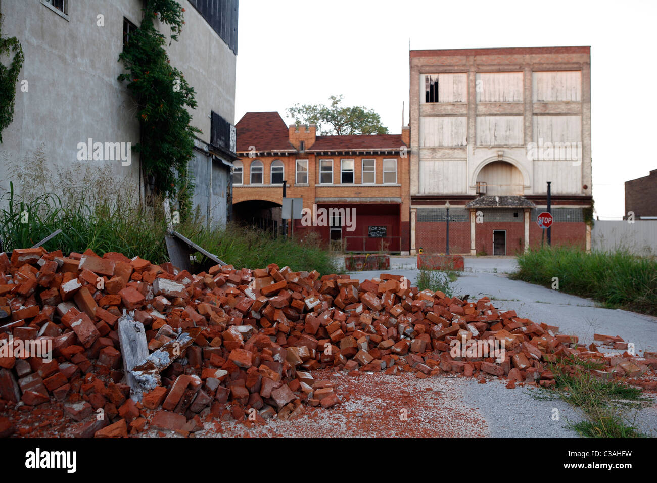 Bricks from a collapsed building covers a street in decaying Cairo ...
