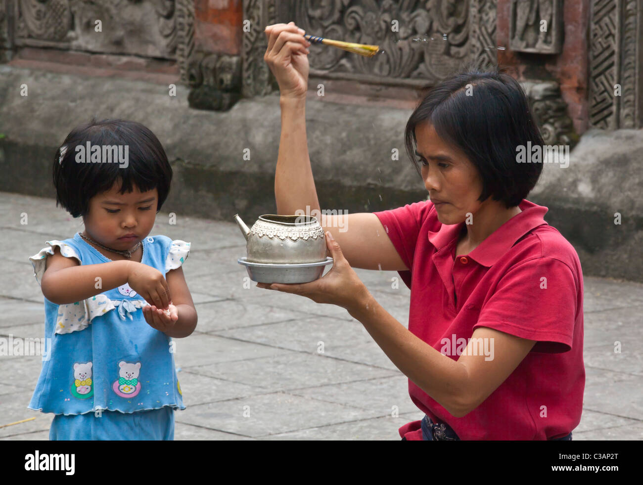 BALINESE in a purifying ritual at PURA TIRTA EMPUL a Hindu Temple ...