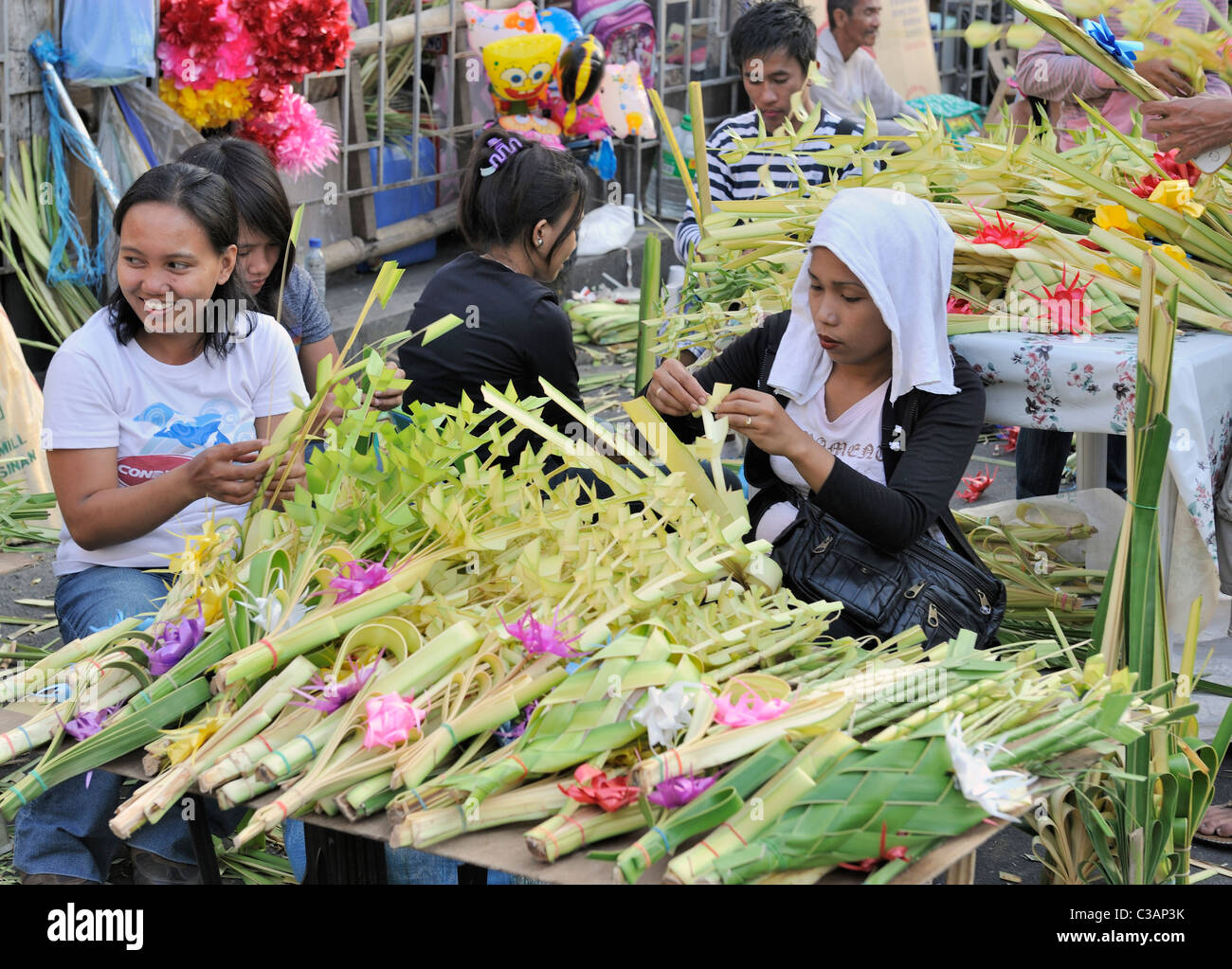 Women making colorful decorations on Palm Sunday outside the Minor ...