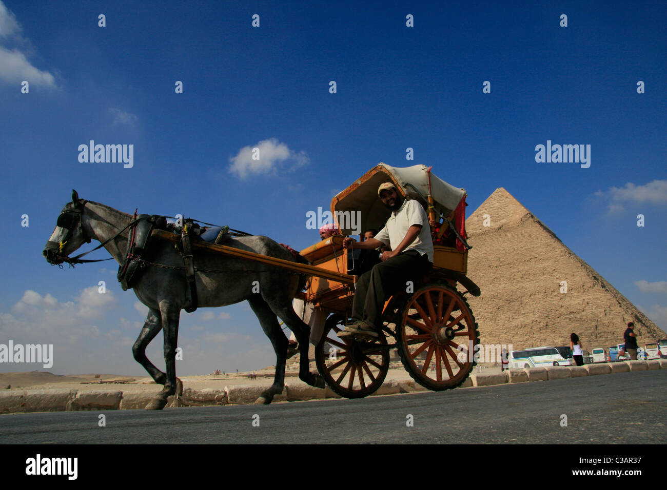 A horse drawn carriage in front of the Khafre/Chephren pyramid at Giza ...
