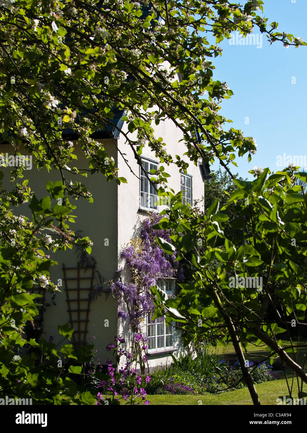 Nice english house on a spring day Stock Photo - Alamy