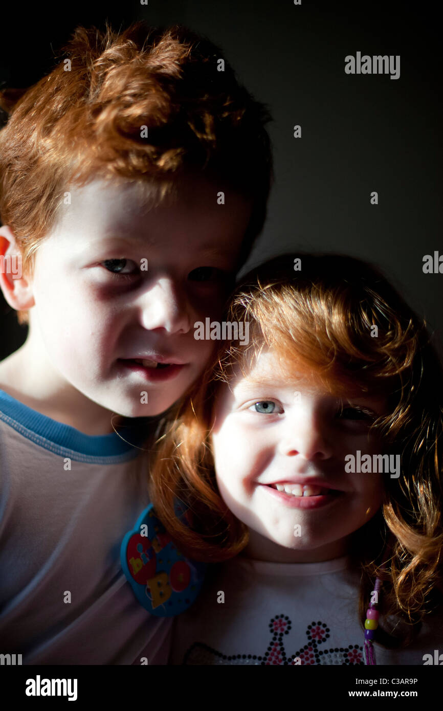 Brother sister cuddling hi-res stock photography and images - Alamy