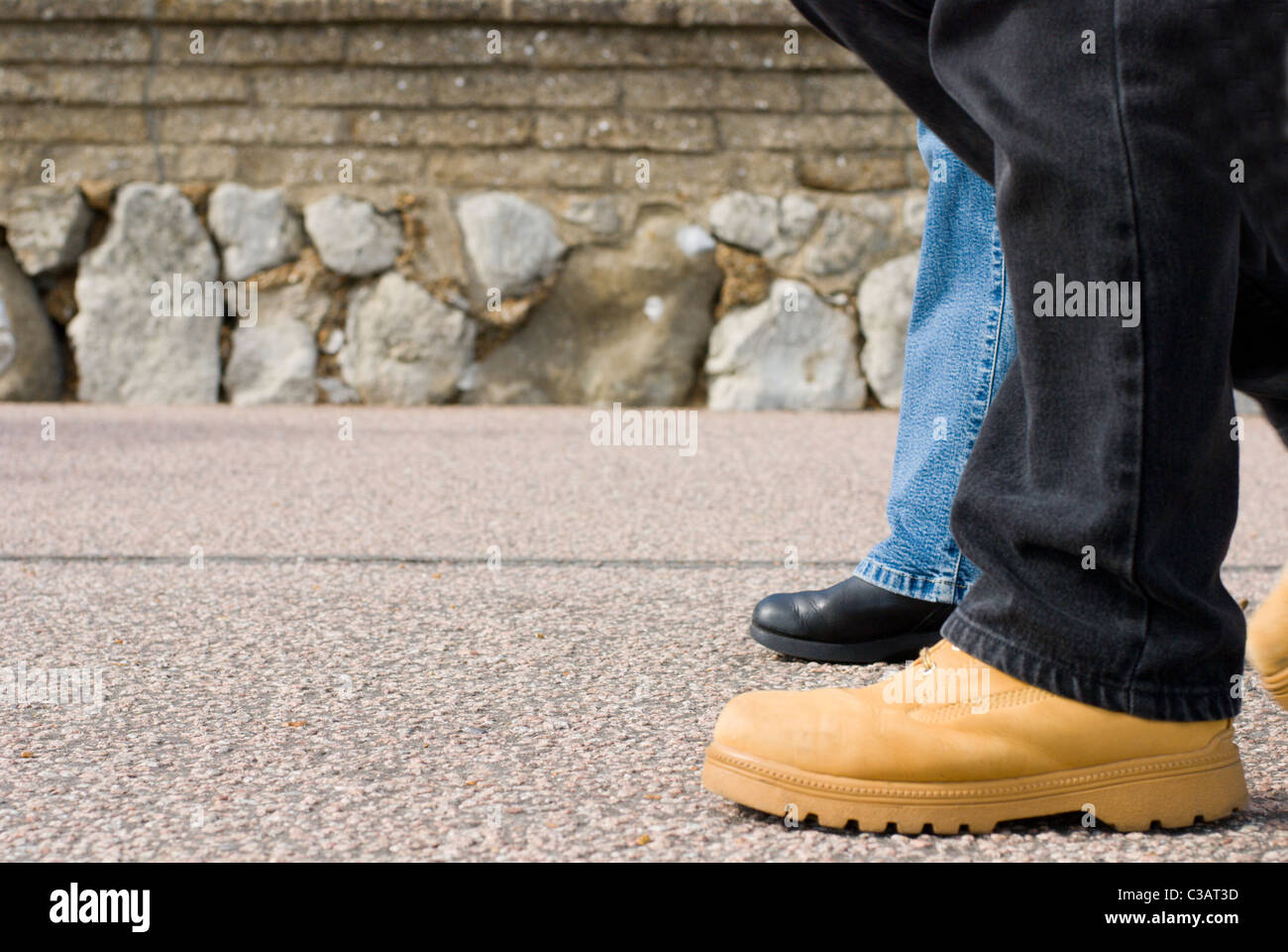 Two people are walking together Stock Photo - Alamy