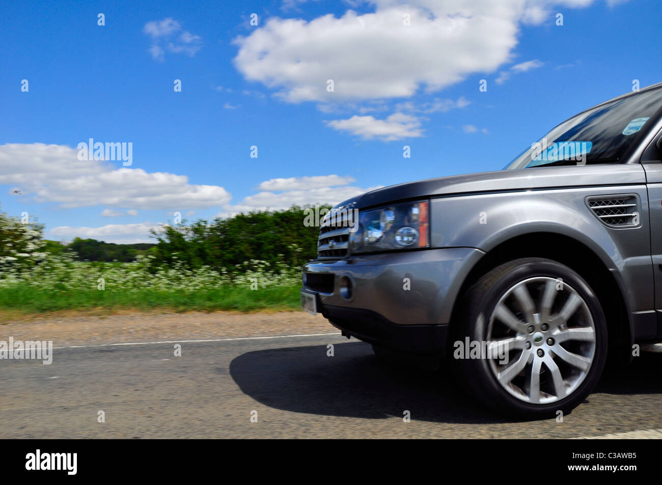Range Rover 4x4 SUV driven on a country Lane Stock Photo - Alamy