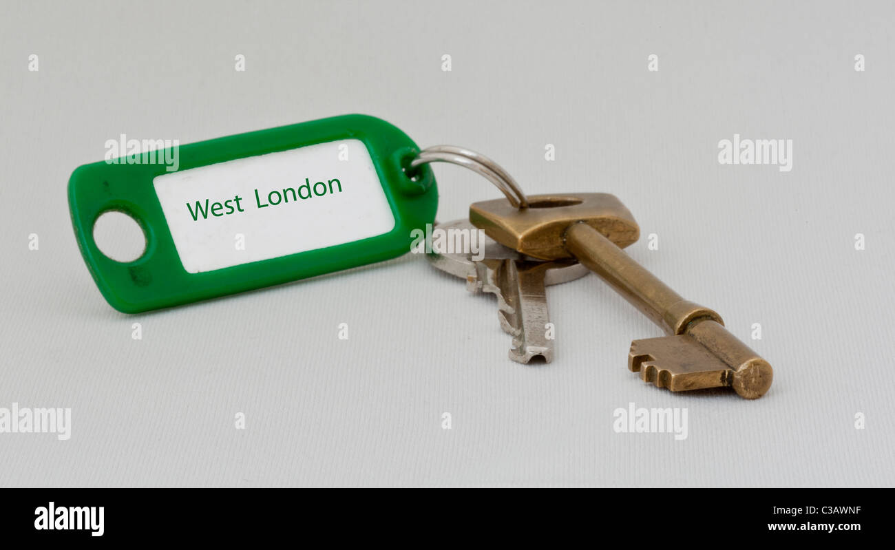 Two keys with a tag with West London written on it. One is a Chubb type ...