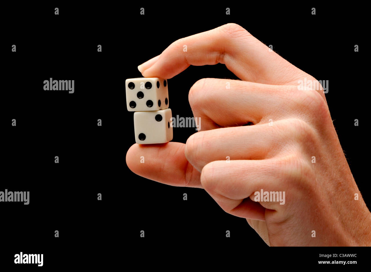hand holding dice close up Stock Photo - Alamy