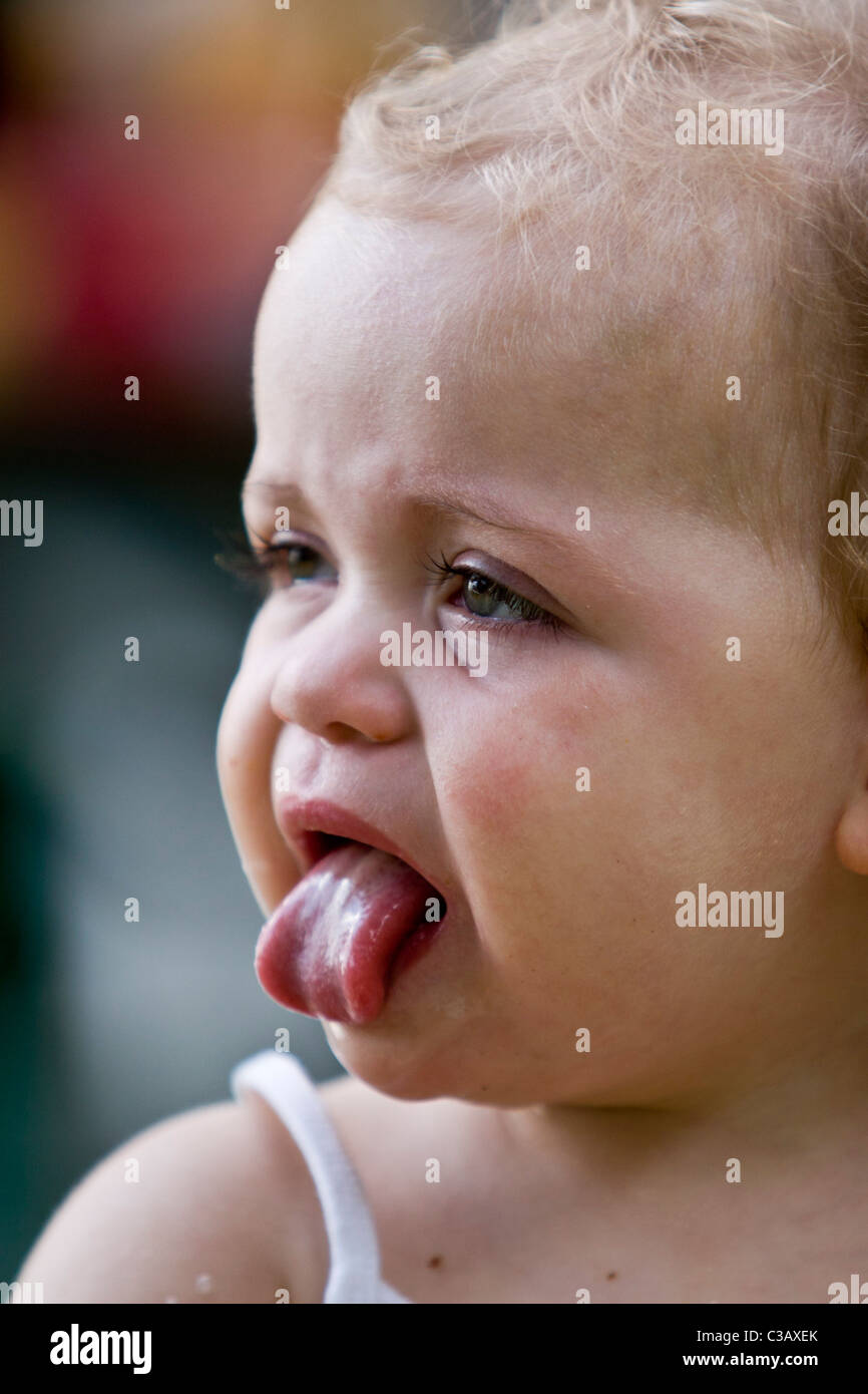 Girl poking out tongue hi-res stock photography and images - Alamy