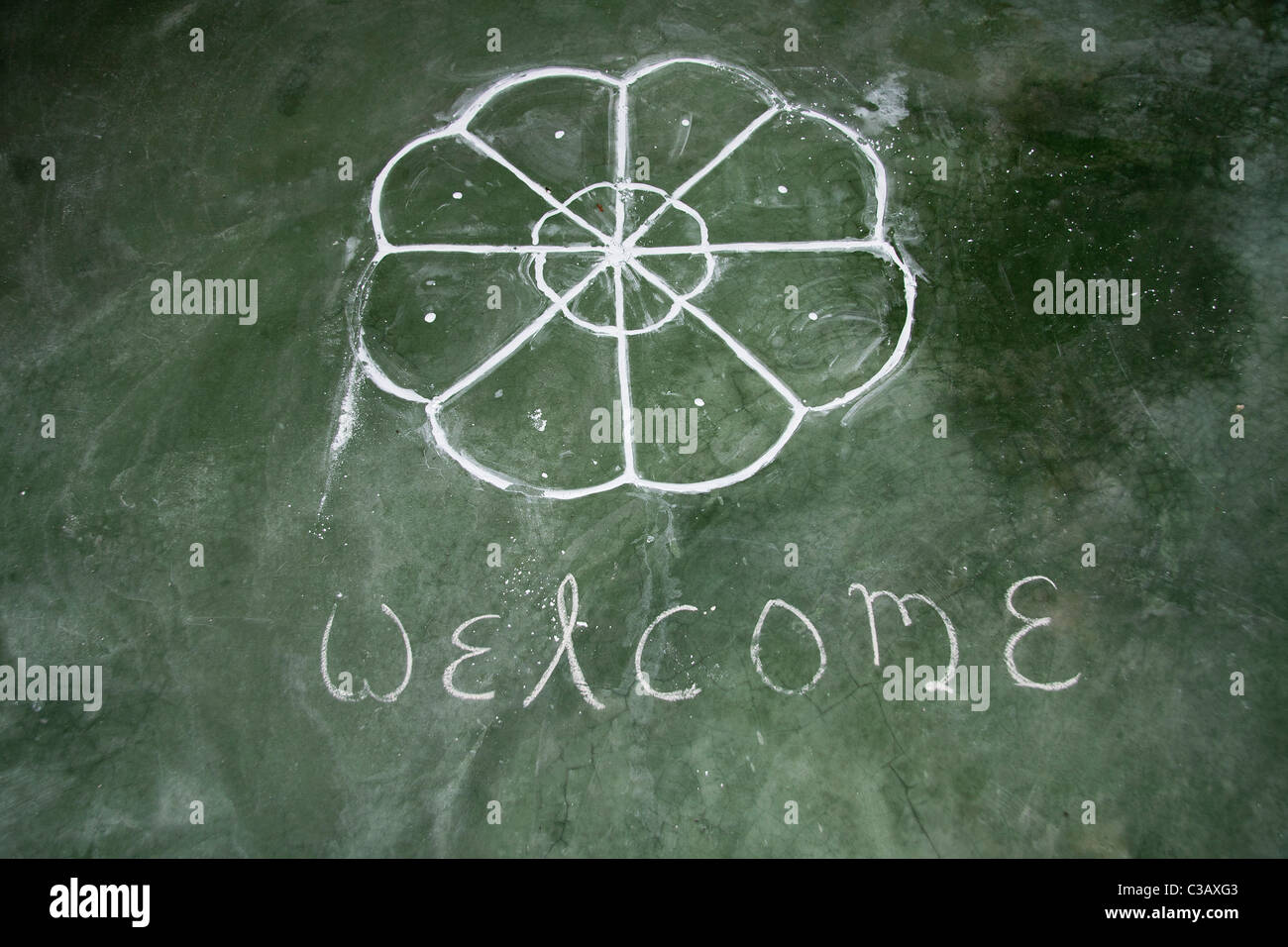 Hindu welcome in chalk Stock Photo - Alamy