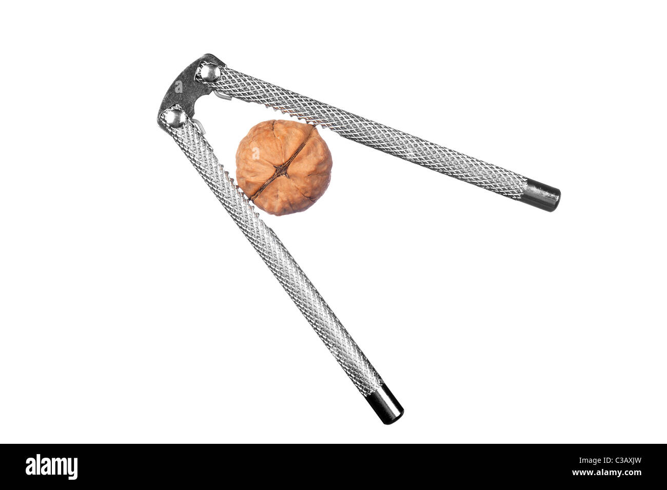 A nut cracker with walnut isolated on white Stock Photo - Alamy