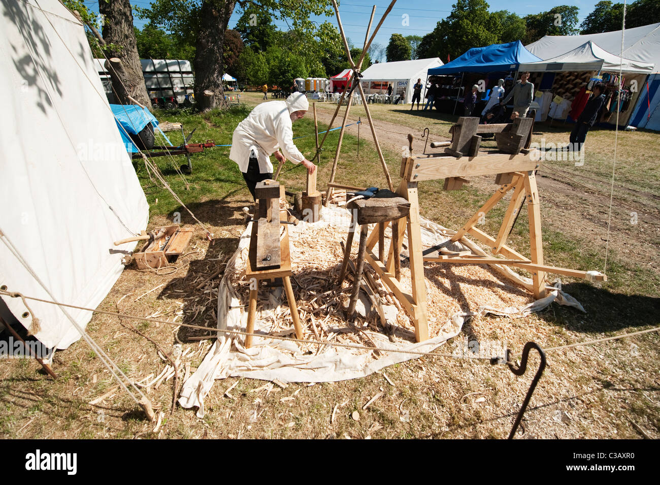 Carpenter operating a traditional hand lathe at the Morden Hall Craft ...