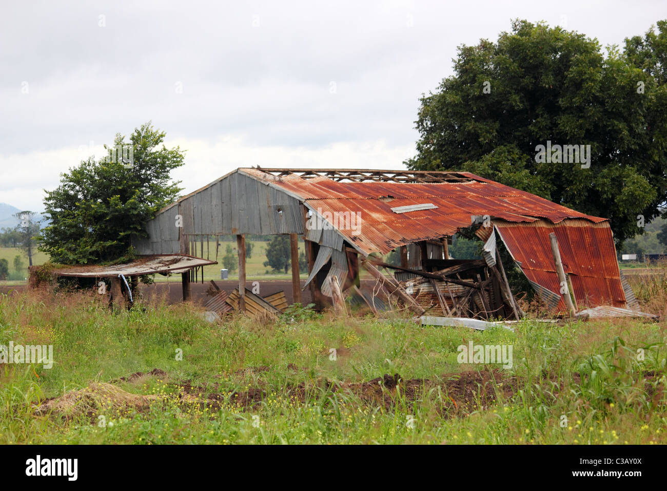 RUSTY FARM SHED DAMAGED BY FLOODWATER BDB12088 HORIZONTAL Stock Photo ...