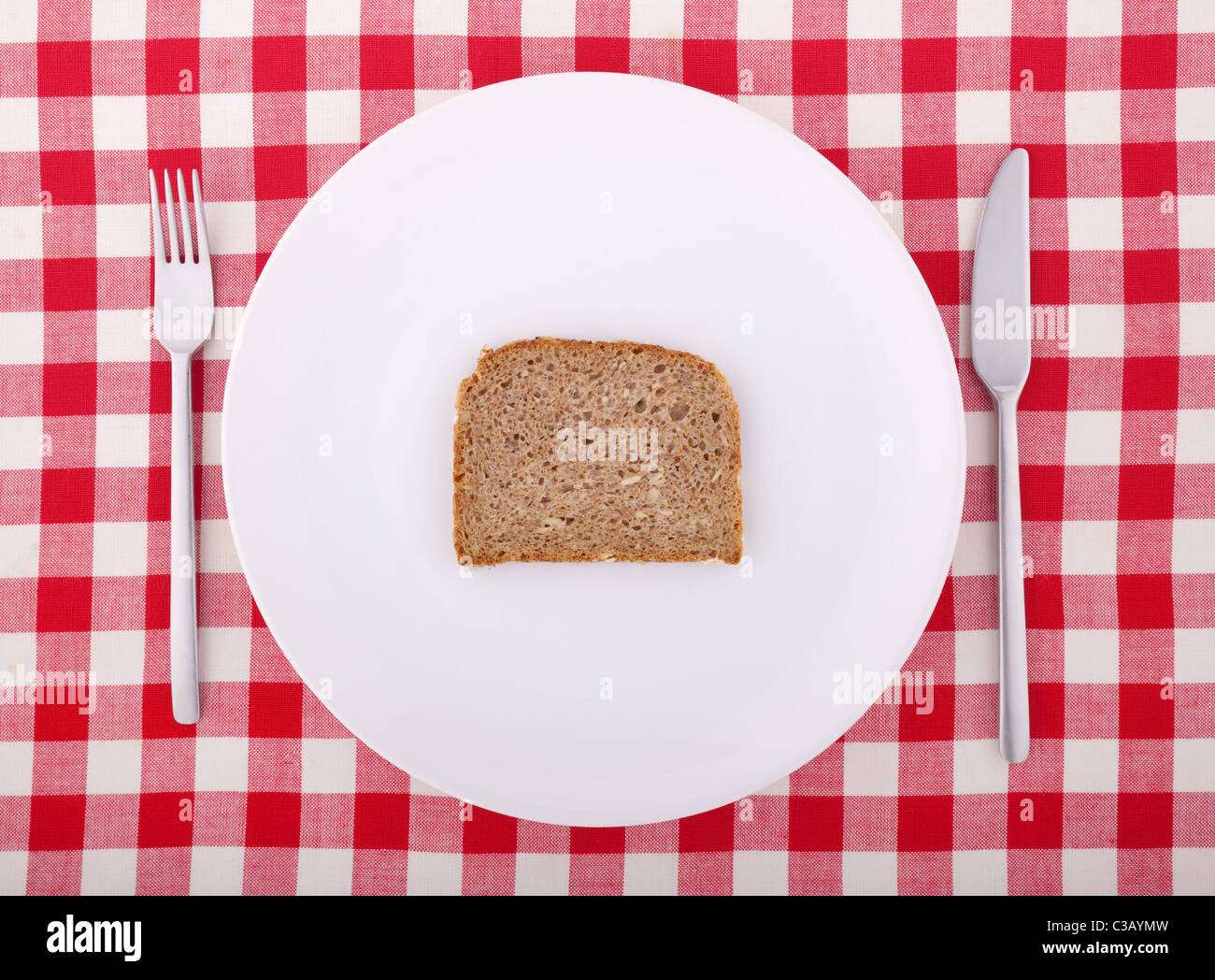 Table setting with fork, knife and a slice of bread on the plate Stock ...