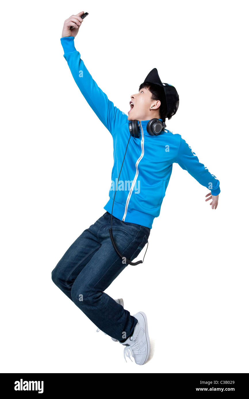 Man holding phone looking up standing Cut Out Stock Images & Pictures ...