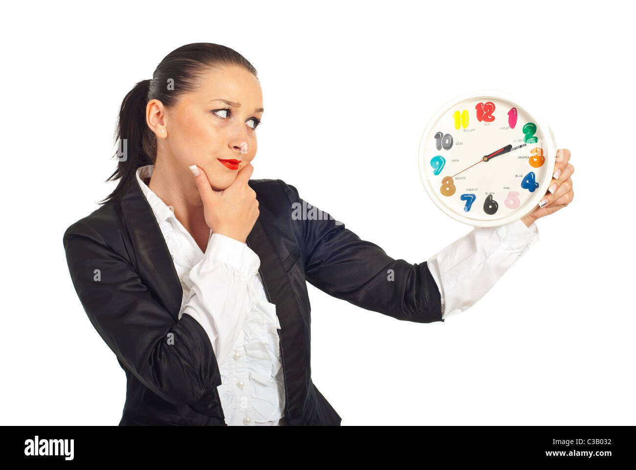 Thinking business woman with mistrustful face looking at clock isolated ...