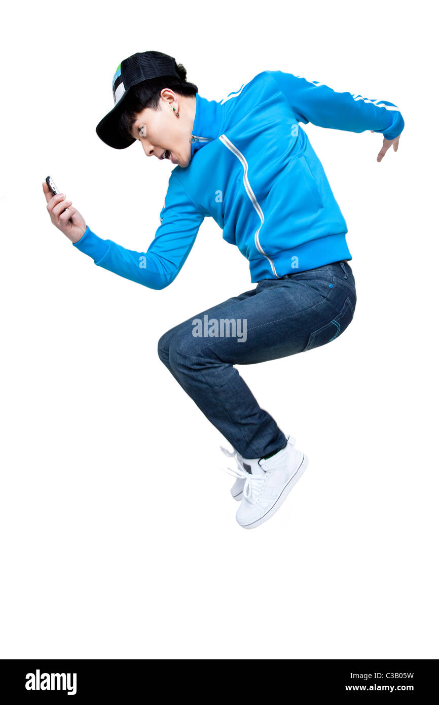 excited man jumping up with phone Stock Photo - Alamy