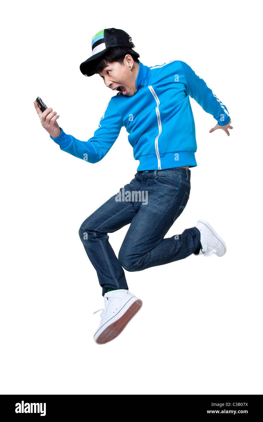 excited man jumping up with phone Stock Photo - Alamy