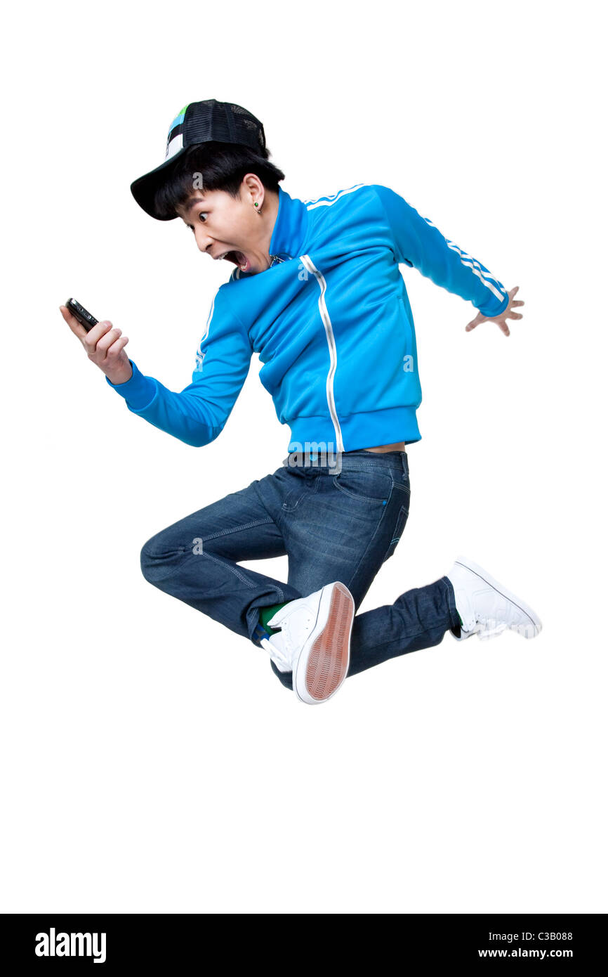 excited man jumping up with phone Stock Photo - Alamy