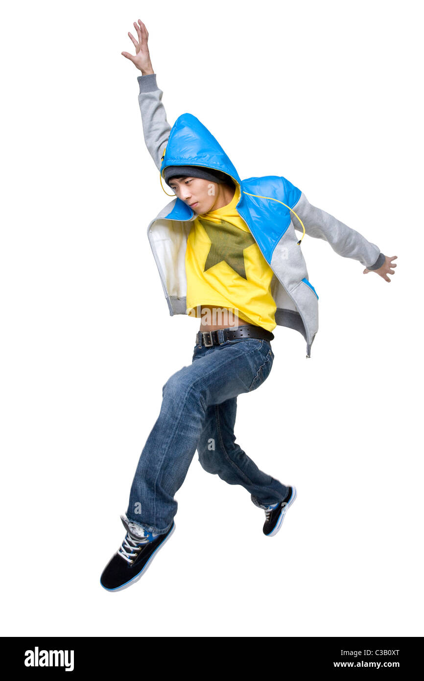 Man jumping up in the air reaching Stock Photo - Alamy