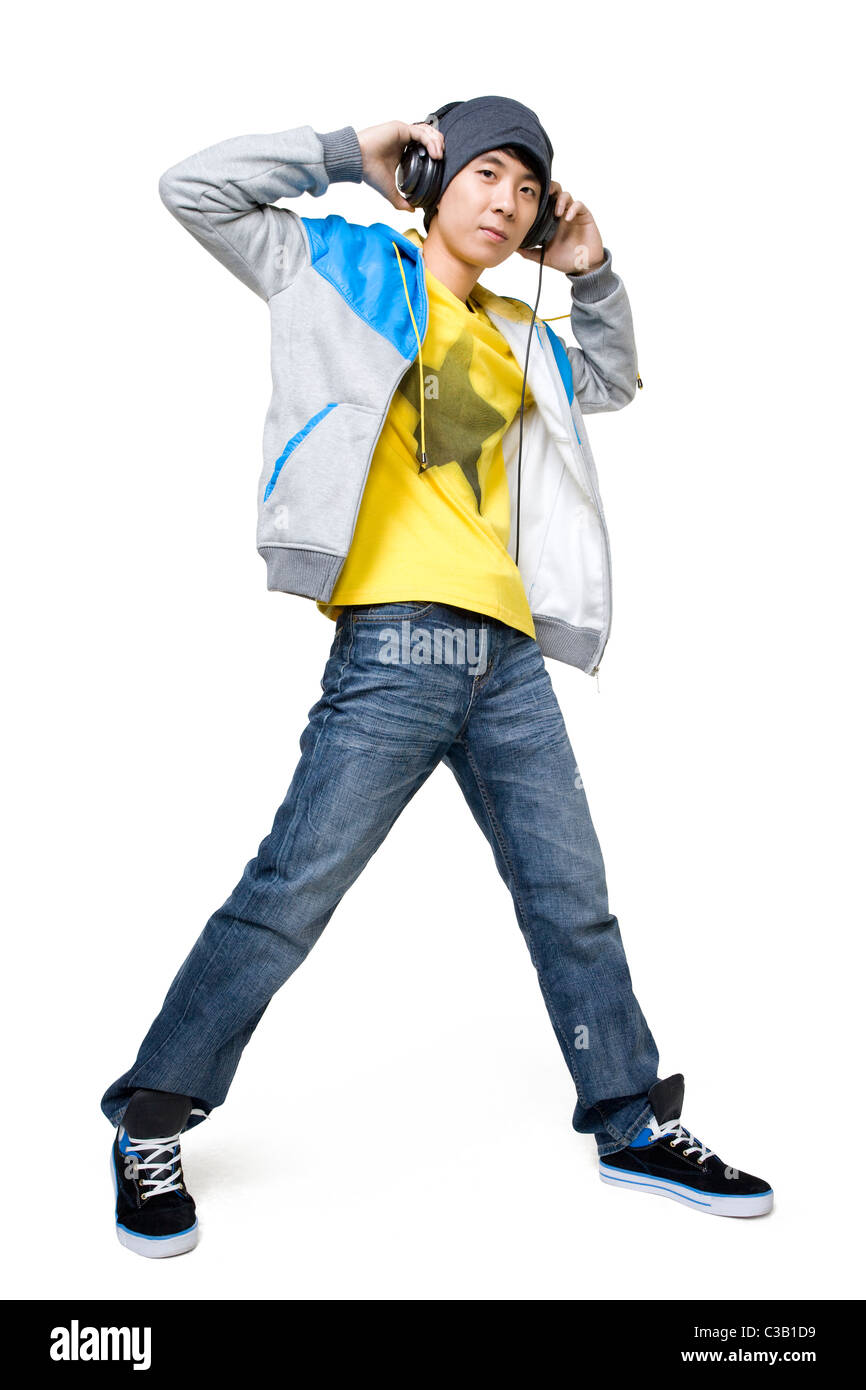 Man posing while listening to music Stock Photo - Alamy