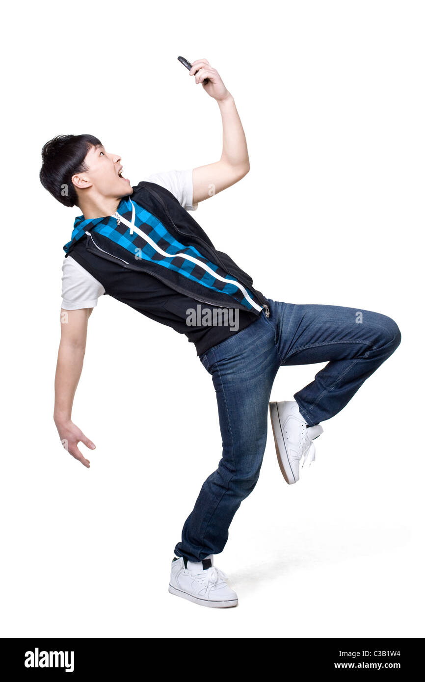 Breakdancer Looking at Mobile Phone Stock Photo - Alamy