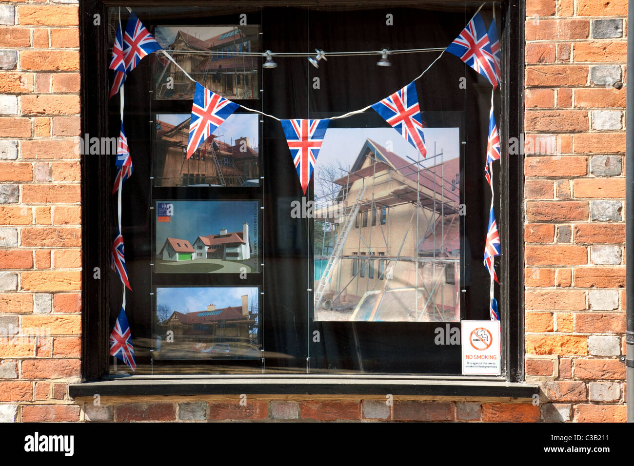Union Jack bunting in an estate agents window advertising new house ...