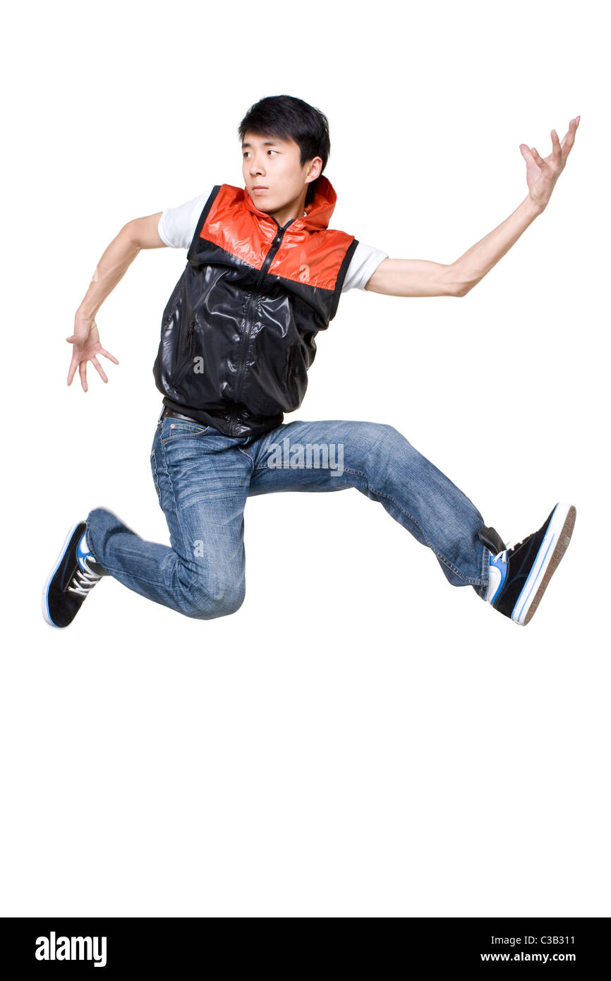 Guy Jumping in the Air with Hands Raised Stock Photo - Alamy