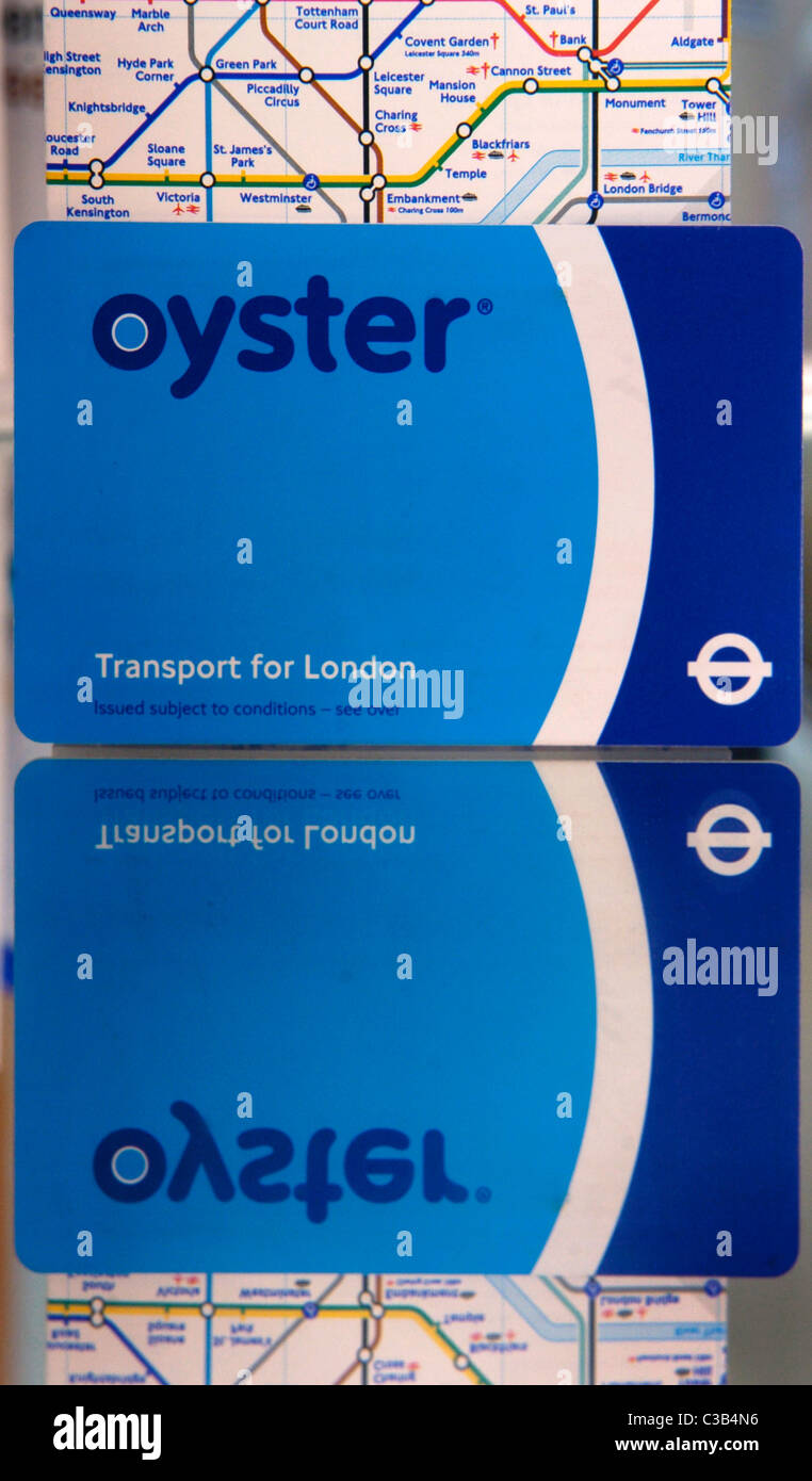 An Oyster Travel Card and a map of the London Underground train network ...